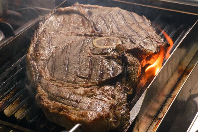 Meat on fire stock image. Image of bone, steak, grid - 155805539