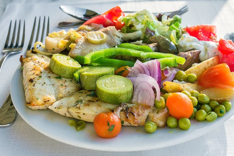 Meat, Fish and Various Vegetable Garnish on a Plate. Stock Image ...