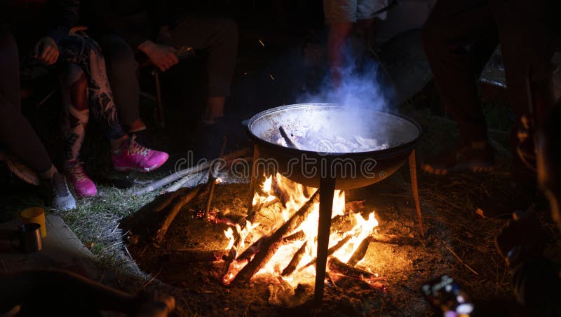 Meat is Fried in a Cauldron on a Fire Stock Image - Image of candle ...