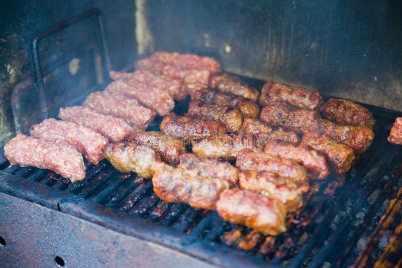 Meat frying on grill stock image. Image of lunch, cooking - 19971191