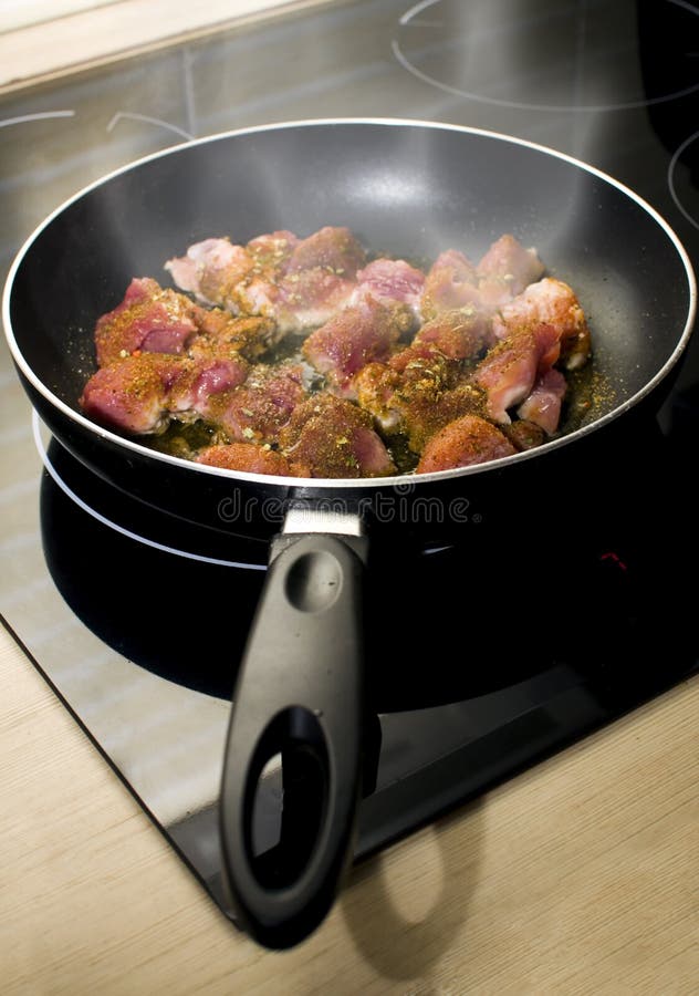 Meat on frying pan stock photo. Image of food, green - 17408162