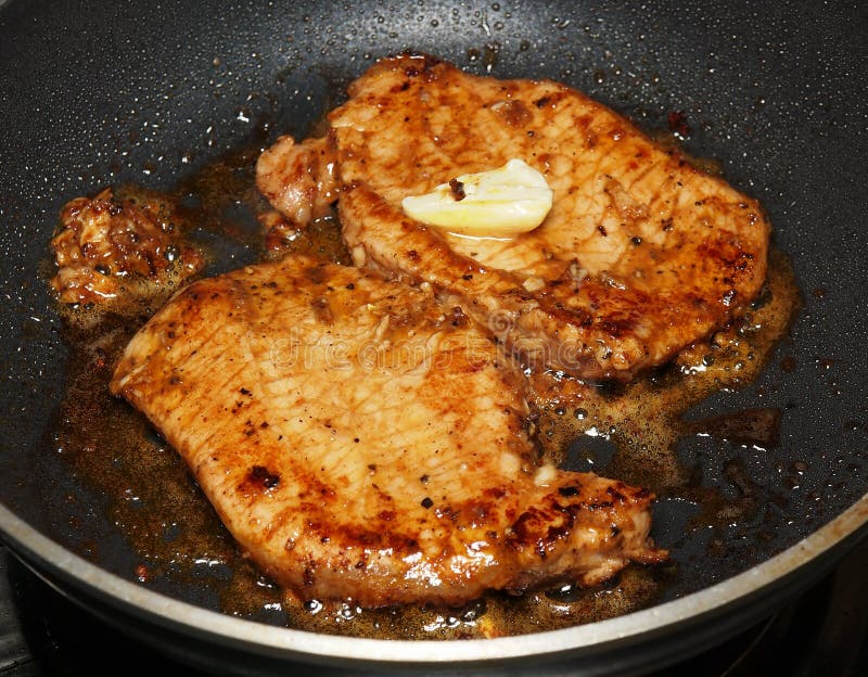Meat frying in a pan stock photo. Image of delicious - 37664056