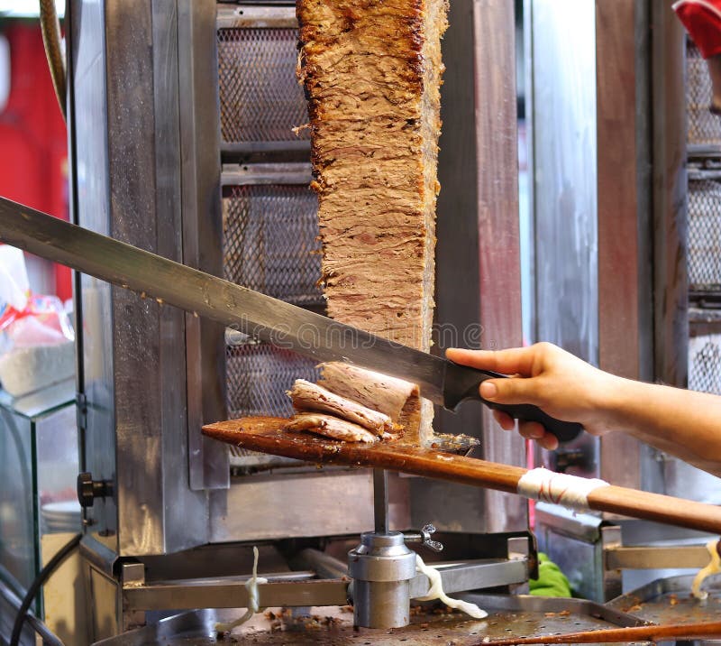 Meat is Grilled on a Large Vertical Rotating Grill. Stock Image - Image ...