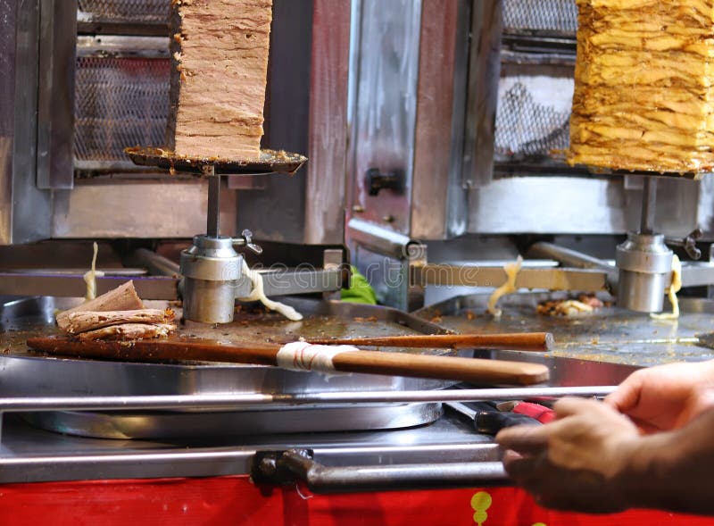 Meat is Grilled on a Large Vertical Rotating Grill. Stock Photo - Image ...