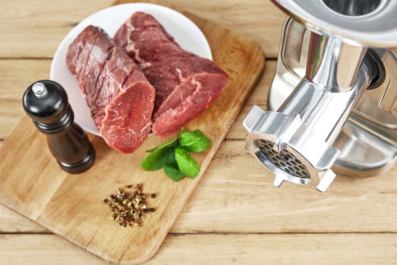 Meat Grinder with Fresh Meat on a Wooden Table. Top View Stock Image ...