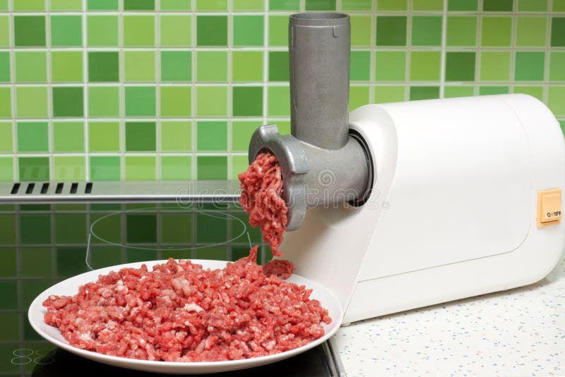 Meat grinder on kitchen stock photo. Image of grind, action - 10666014