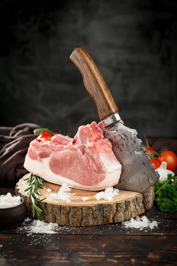 Meat with Kitchen Accessories on an Old Background. Stock Photo - Image ...