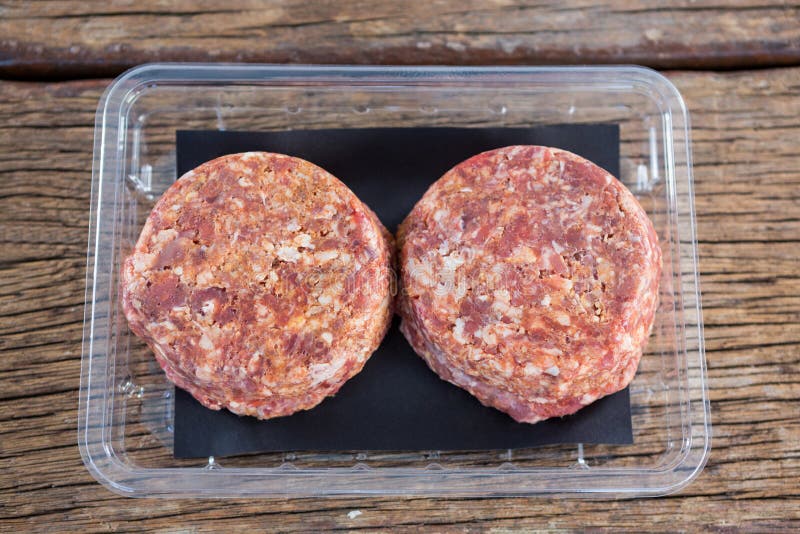 Meat patty in plastic box stock photo. Image of cooking - 87382756