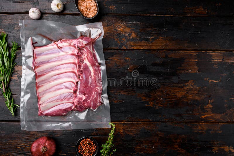 Meat Rib in Plastic Pack Set, on Old Dark Wooden Table Background, Top ...