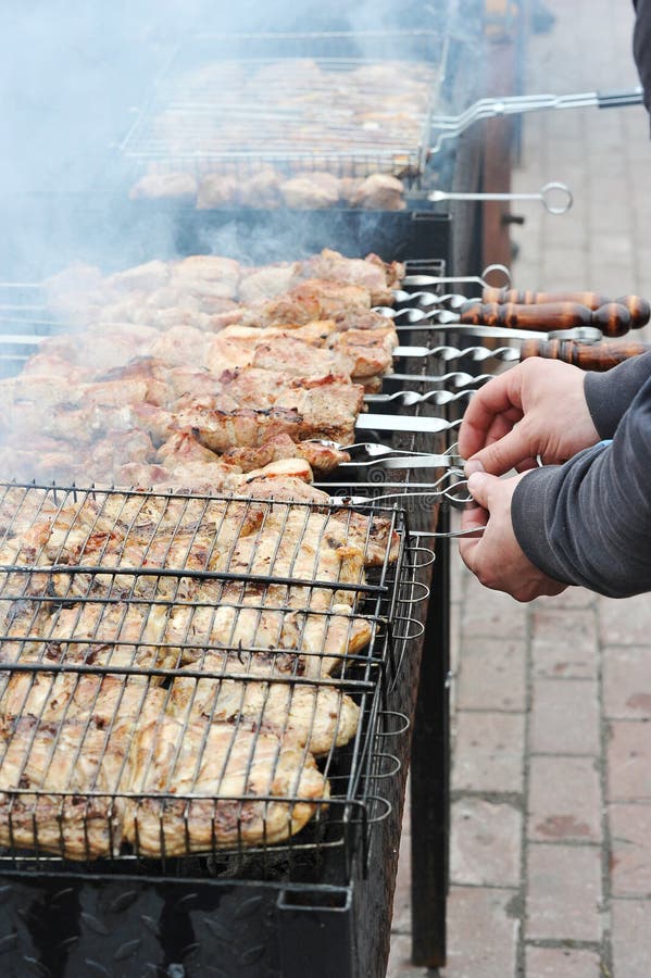 Meat roasting on the grill stock photo. Image of flame - 75174454
