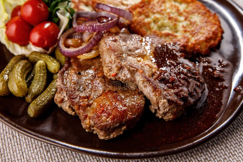 Meat in Sauce with Garnish on a Plate Stock Photo - Image of spicy ...