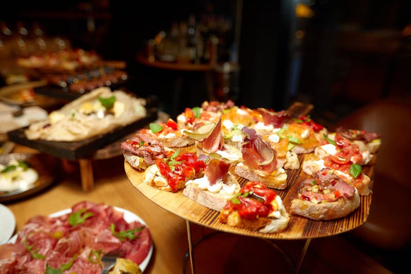 Meat Snacks on a Buffet Table on Bread with Vegetables Stock Photo ...