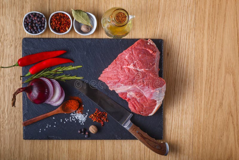 Meat and Spices on Slate Plate Stock Photo - Image of meat, knife: 57999894