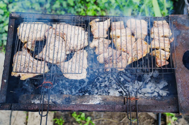 Meat Steaks on a Grill Rack Cooking Over an Open Fire Stock Photo ...