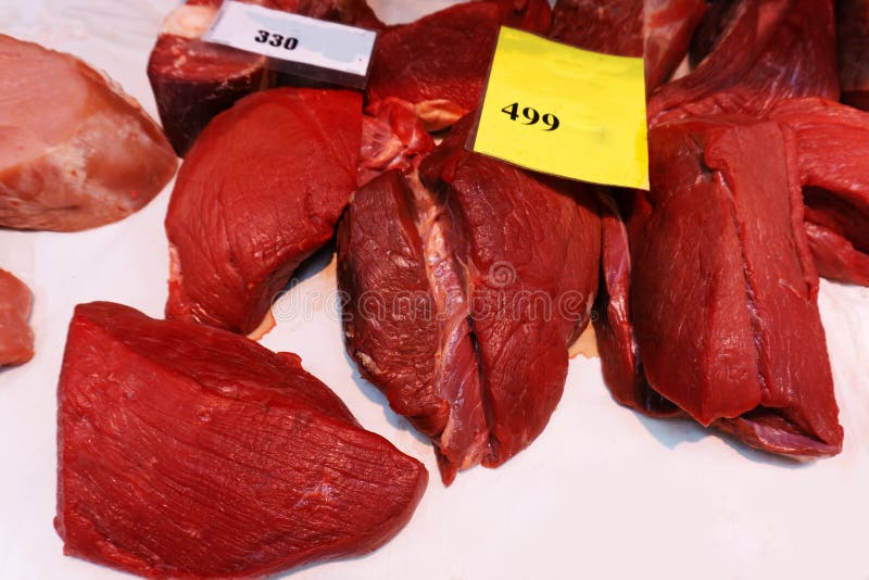 Meat Trade. Large Cuts of Beef on the Counter in the Store Stock Photo ...