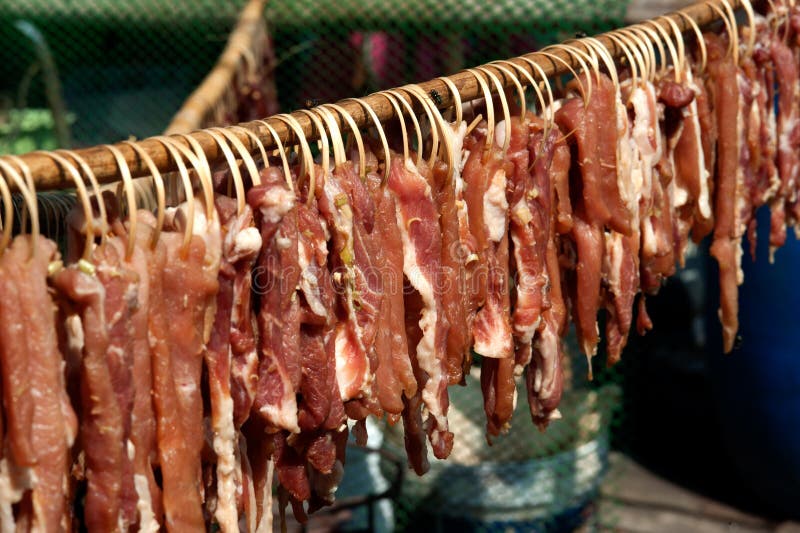 Meats drying in the sun . stock image. Image of rural - 25902457