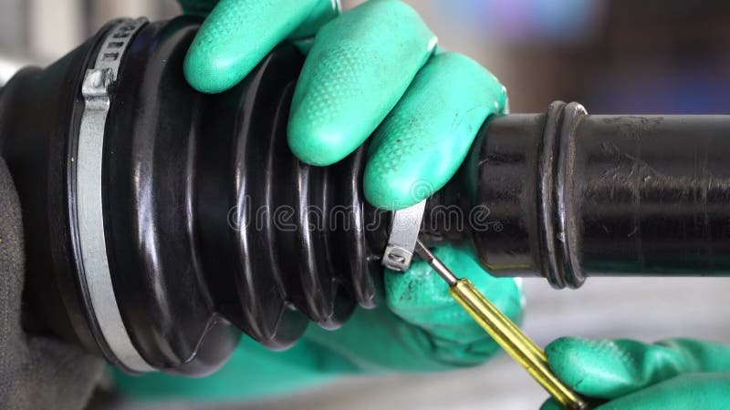 Mechanic Adding Grease To Cv Joint Rubber Sleeves in Garage,macpherson ...