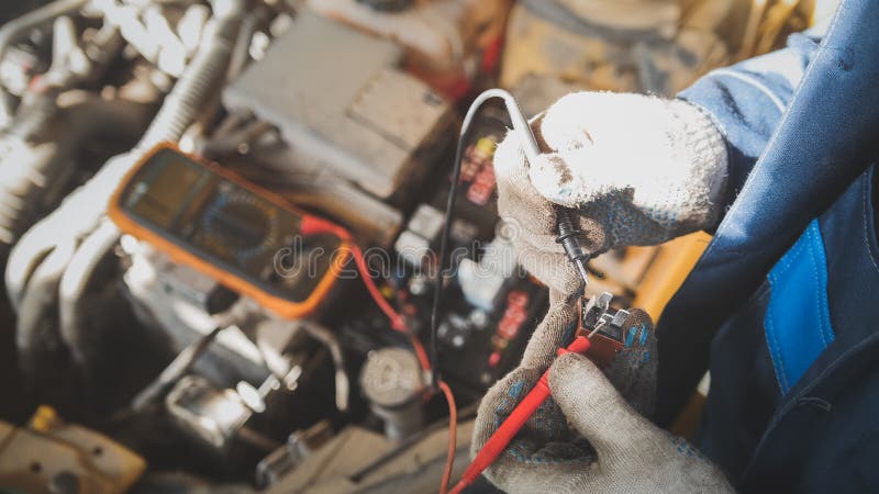 Mechanic in Auto Workshop Works with Car Electrics - Electrical Wiring ...
