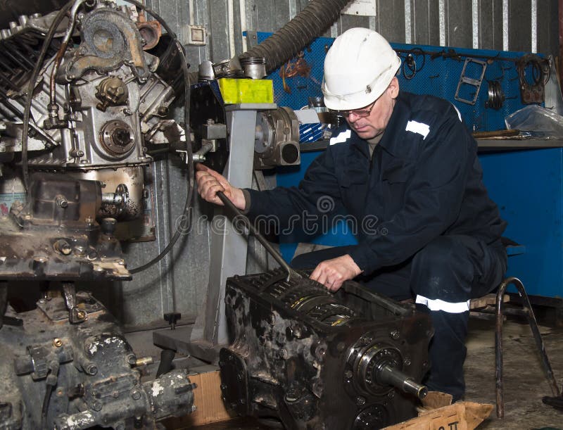 Mechanic Behind Work in Garage Stock Photo - Image of mechanical ...
