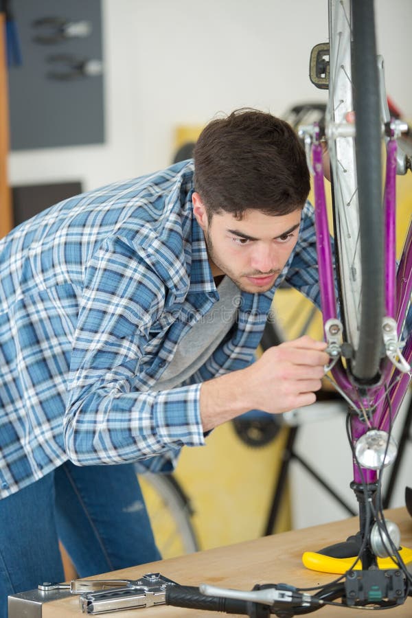 Mechanic with Bicycle on Workbench Stock Image - Image of service ...