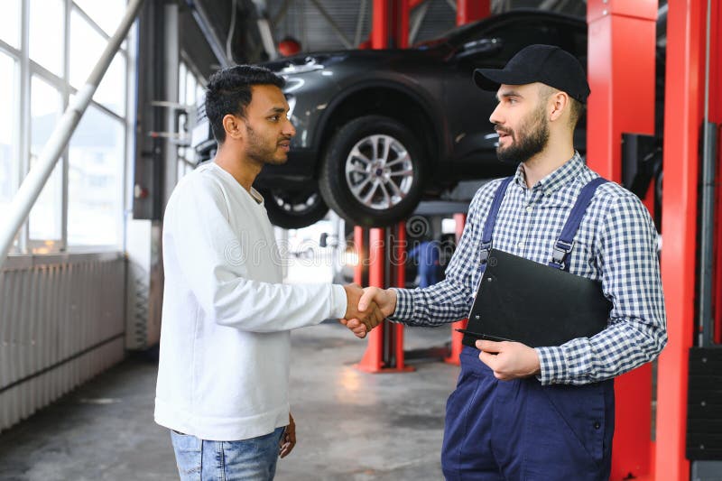 A Mechanic in a Car Service Repairs an Indian Man S Car. Car Service ...