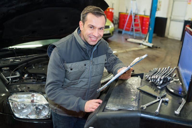 Mechanic at Car at Workshop Stock Image - Image of auto, vehicle: 277100943