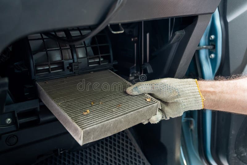 A Mechanic Changes the Cabin Air Filter of a Car. Stock Image - Image ...