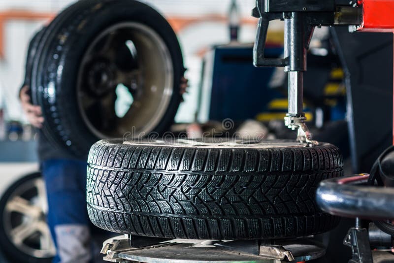 The Mechanic Changes Wheels To a Modern Car Stock Photo - Image of auto ...