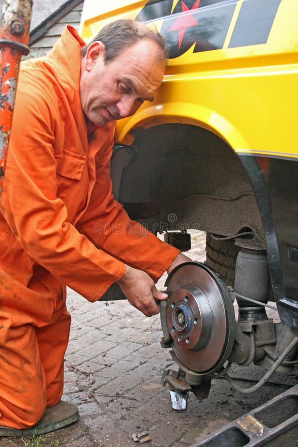Mechanic Changing Brake Disc Stock Image - Image of brake, maintenance ...