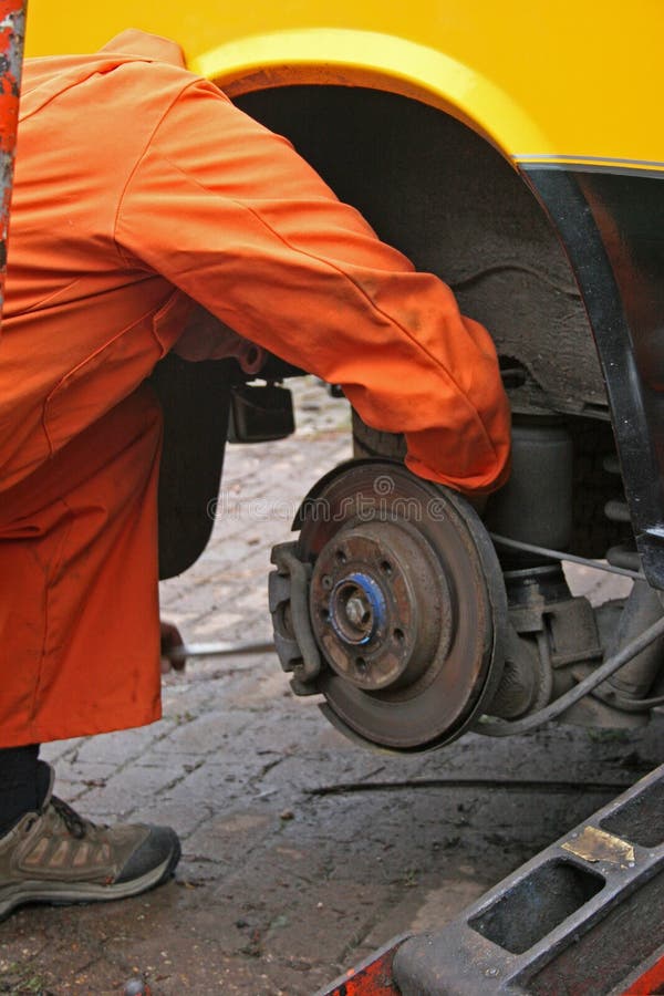 Mechanic Changing Brake Disc Stock Photo - Image of vehicle, aerosol ...