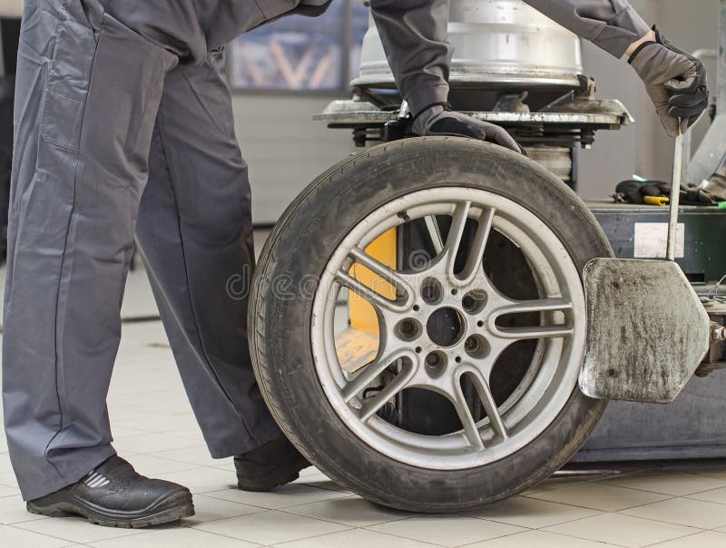 Mechanic Changing Car Tire. Stock Photo - Image of closeup, pneumatic ...