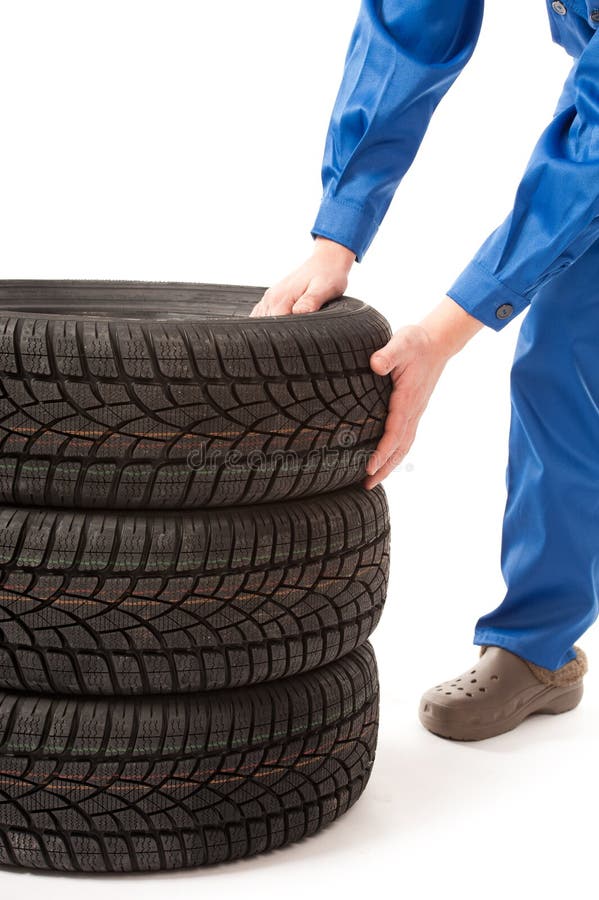 Mechanic in His Workshop Changing Tires or Rims Stock Image - Image of ...