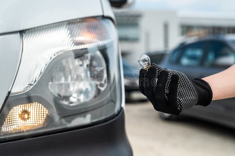 Mechanic Changing Light Bulb in His Car Stock Photo - Image of modern ...