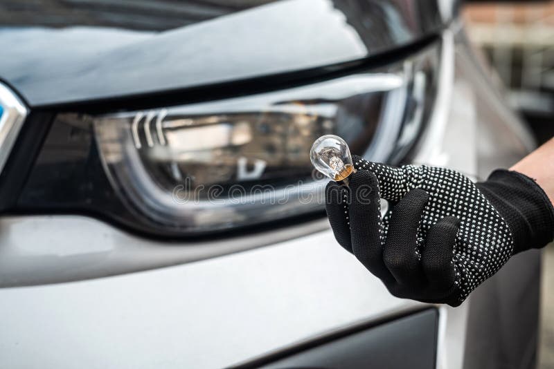 Mechanic Changing Light Bulb in His Car Stock Photo - Image of ...
