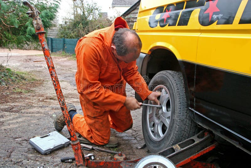 Mechanic changing wheel stock photo. Image of work, truck - 7914744