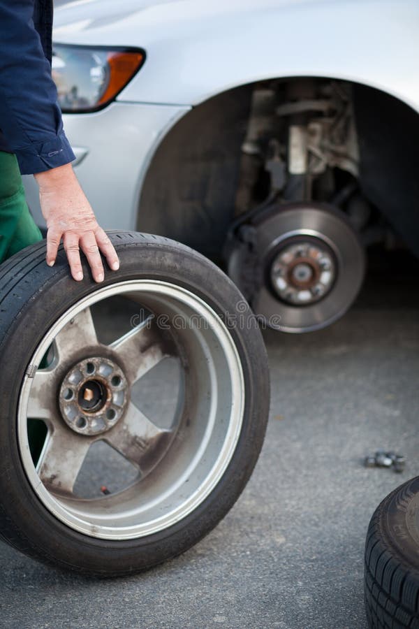Close-up of Changing Wheel on Car - with Pneumatic Stock Image - Image ...