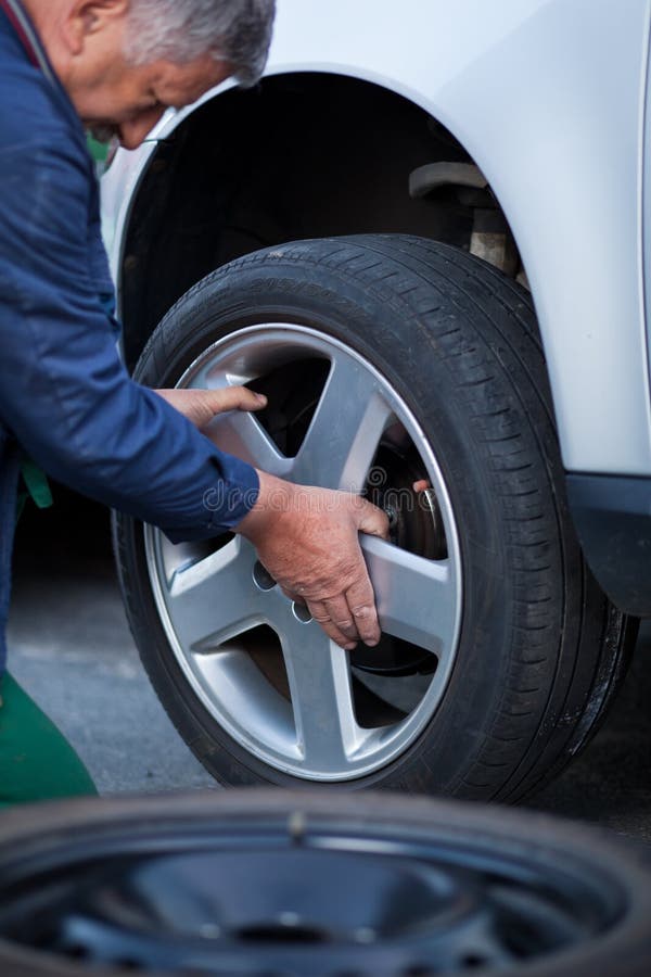 Young Boy Changing Tire stock image. Image of helping - 60161393