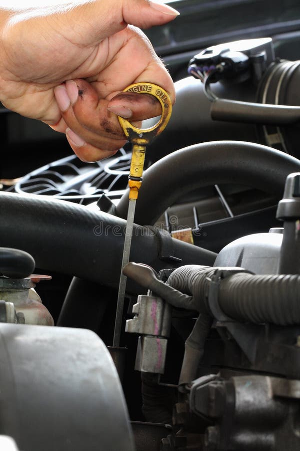 Mechanic Check the Oil in the Engine Stock Image - Image of collar ...