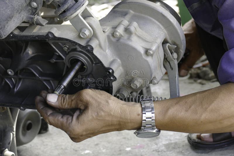 The Mechanic Check the Pulley and Belt of Motorcycle Stock Image ...