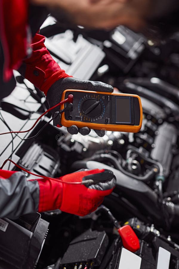 Mechanic Checking Battery of Car in Workshop Stock Image - Image of ...