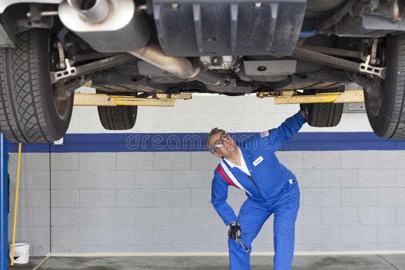 Mechanic Checking the Car at Automobile Repair Shop Stock Image - Image ...