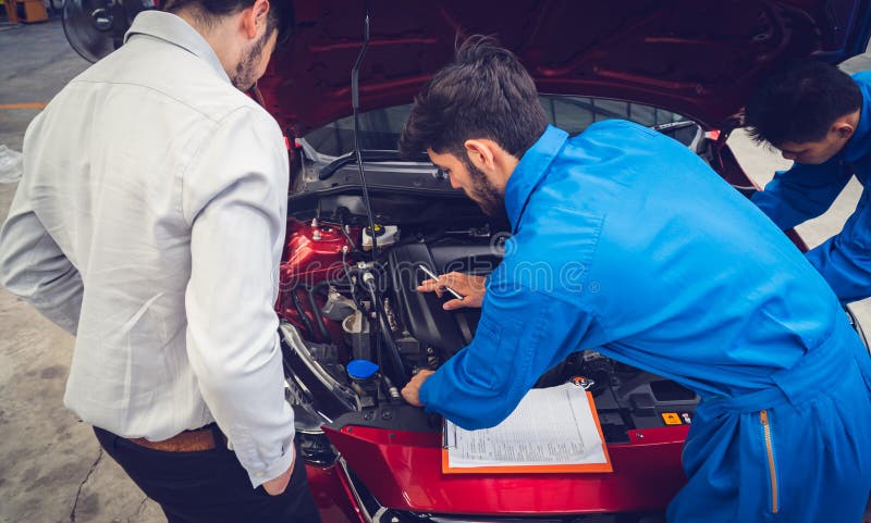 Mechanic Checking Car with the Owner. Auto Services Concepts Stock ...