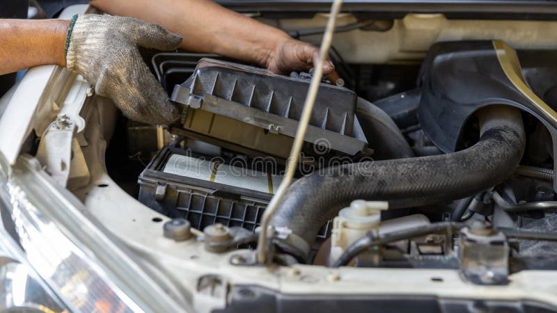 Car Mechanic Checking Oil Quality the Engine Motor Car Transmission and ...