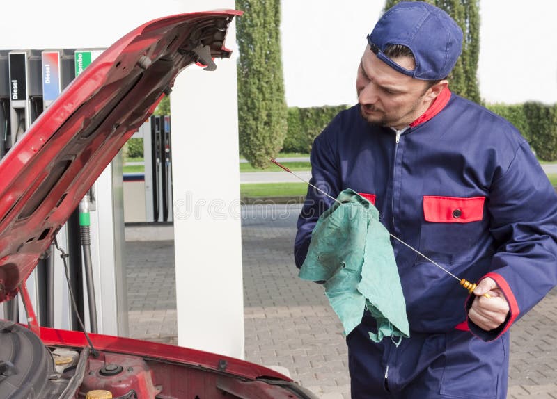 Mechanic Checking Engine stock photo. Image of petrol - 16651418