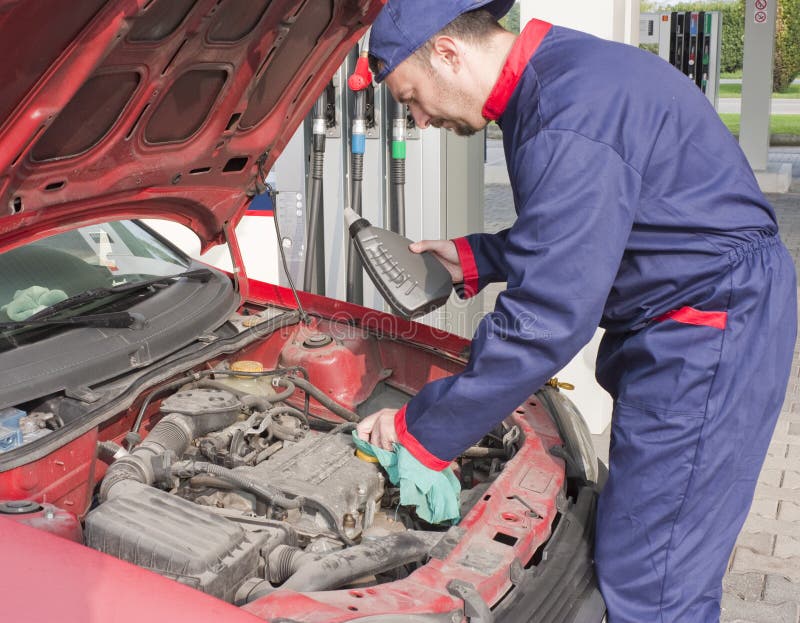 Mechanic Checking Engine stock photo. Image of maintenance - 16651430