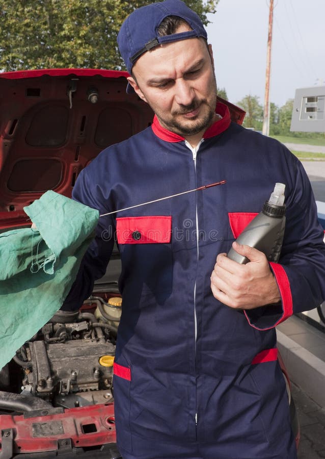 Mechanic Checking Engine stock photo. Image of service - 16686296