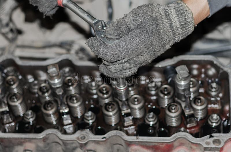 The Mechanic is Checking the Engine. Stock Image - Image of background ...