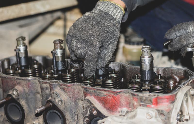The Mechanic is Checking the Engine. Stock Image - Image of automobile ...