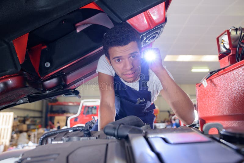 Mechanic checking engine stock photo. Image of check - 241702738