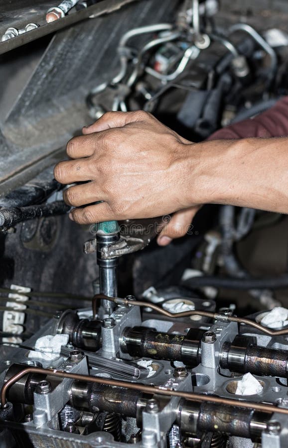 The Mechanic is Checking the Engine. Stock Image - Image of automotive ...